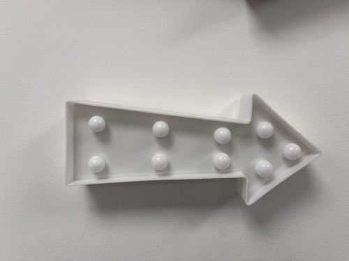 Wall mounted white plastic arrow sign battery operated 22.5cm long/10cm ...
