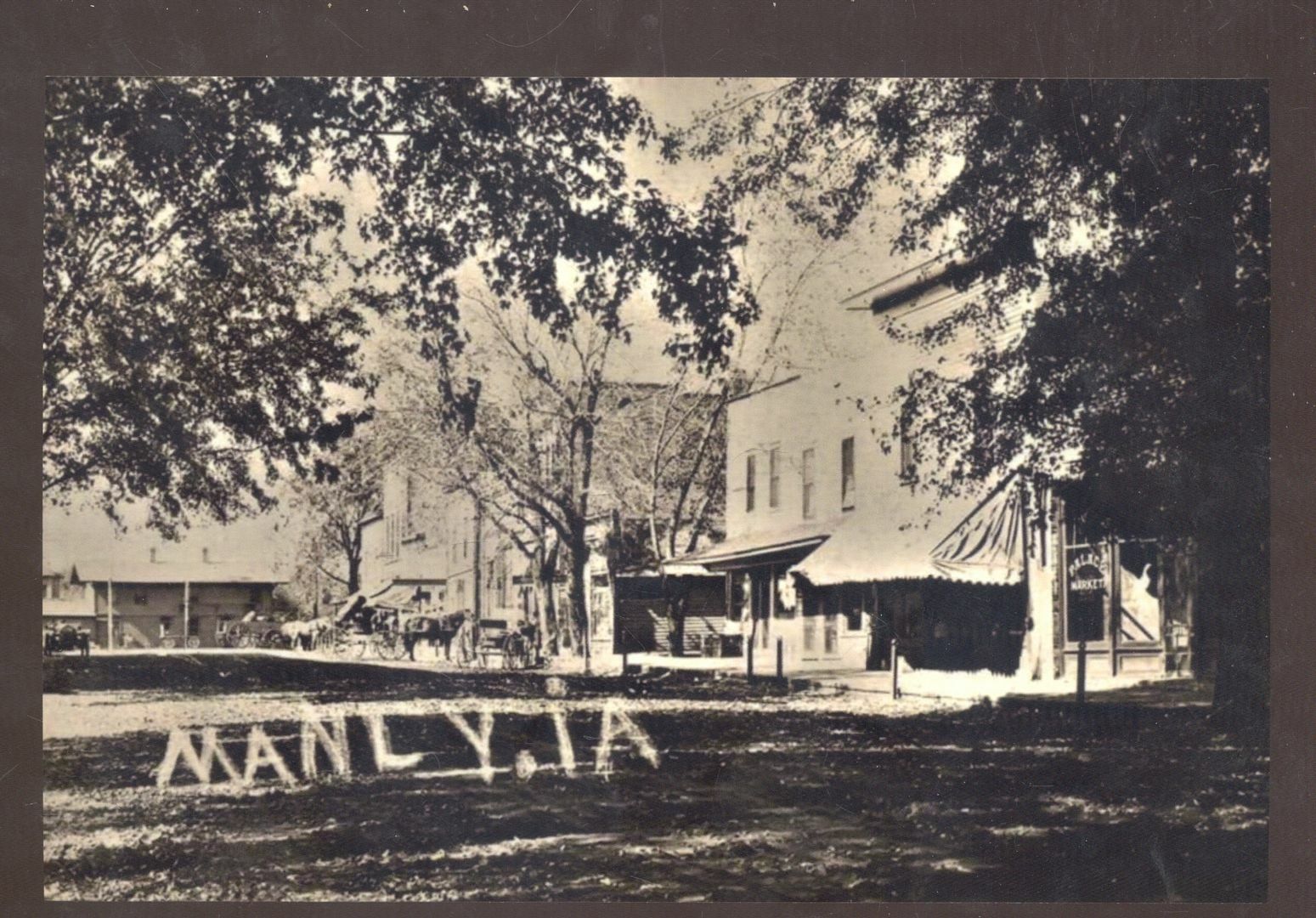 REAL PHOTO MANLY IOWA DOWNTOWN STREET SCENE HORSES STORES POSTCARD COPY ...