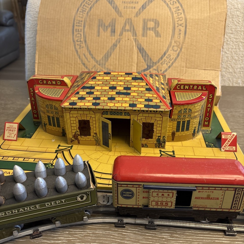 vintage marx electric train set dated 1939. Several train cars and ...