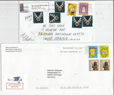 The Simpsons stamps -- Homer, Lisa and Bart -- on two air envelopes to ...