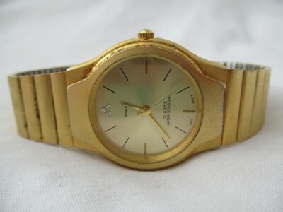 Nisken Watch Gold Tone Stainless Steel Band Round Face Water Resist | eBay
