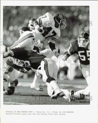 1987 Press Photo Gerald Willhite goes over the top during first half ...