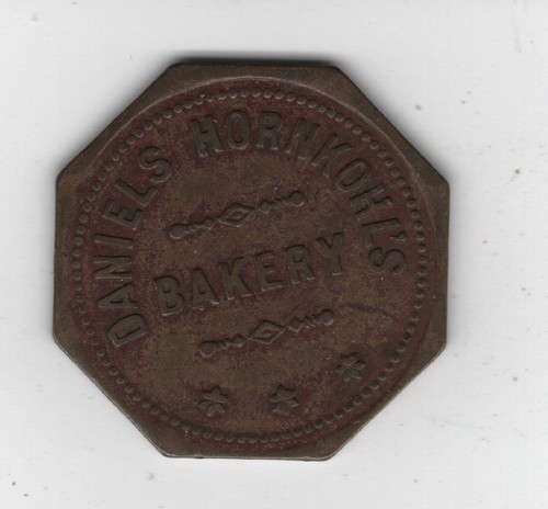 "DANIELS HORNKOHL'S BAKERY" (maverick loaf of bread token) MANISTEE ...