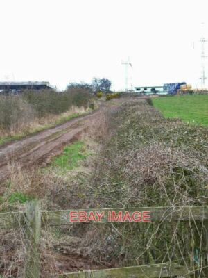 PHOTO FARM ROAD NEAR HASWELL PLOUGH VIEWED FROM THE B1283. WIND TURBINE ...