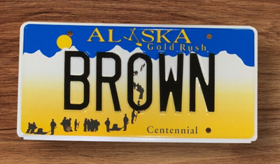 ALASKA GRAPHIC GOLD RUSH VANITY LICENSE PLATE " BROWN " UPS BOB BILL ...