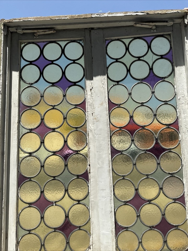 Spanish revival rondell style casement windows with colored glass in ...