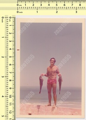 Beach Shirtless Man in Trunks Holding Fish Muscular Guy Handsome ...