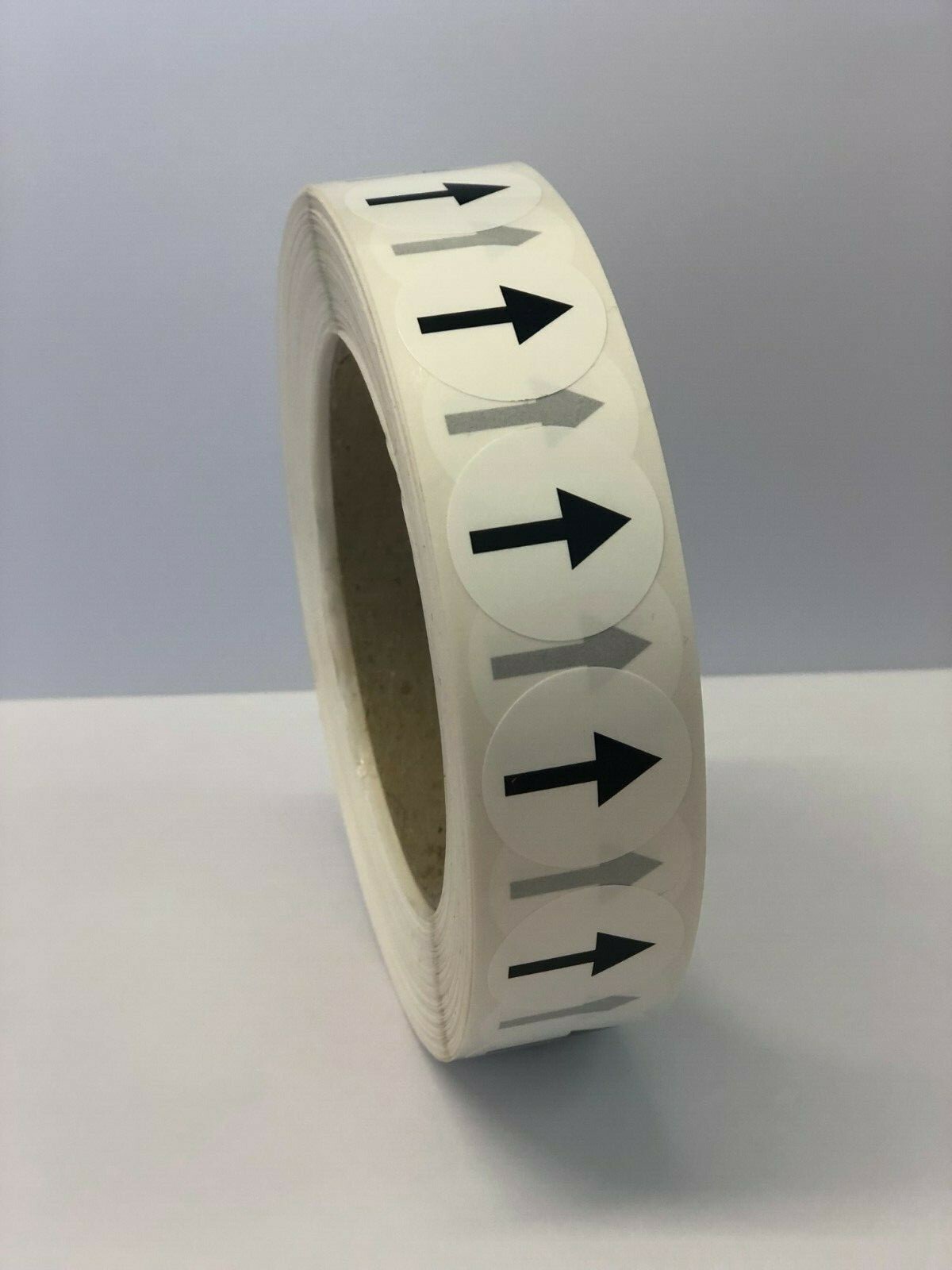Direction arrow stickers round labels 25mm Dia white with black arrow ...