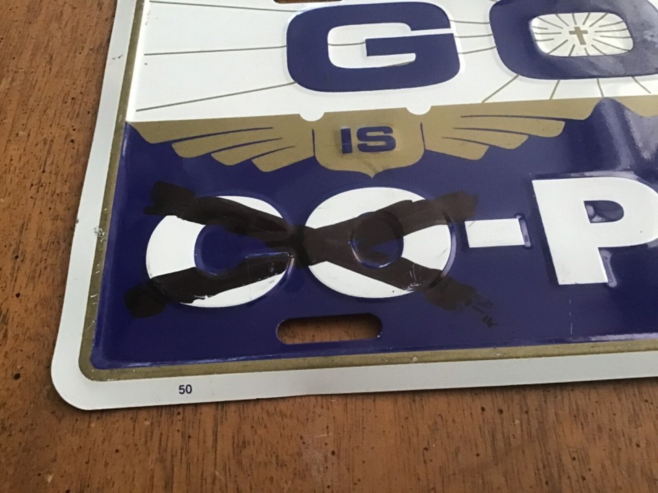 God Is My Co Pilot License Plate Booster Co is crossed out with marker ...