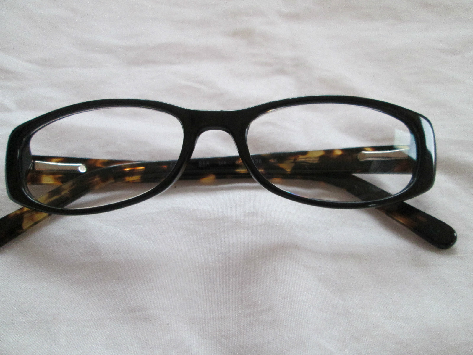 Kirkland Signature brown tortoiseshell / black glasses frames. With ...