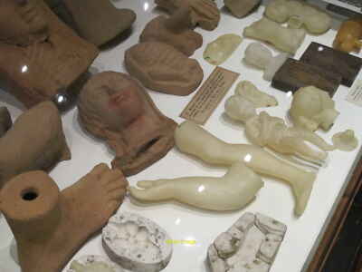 Photo 12x8 Votive offerings Pitt Rivers Museum These are models of body ...