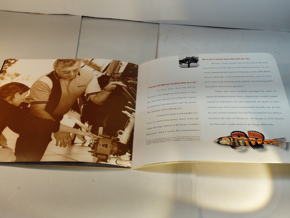 1998 Saturn brochure. New. 14 pages w foldout. A Different Kind of ...