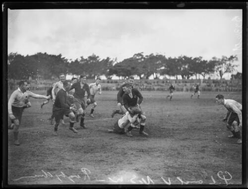 Low rugby tackle in a Queensland versus NSW Rugby Union game, Augu- Old ...