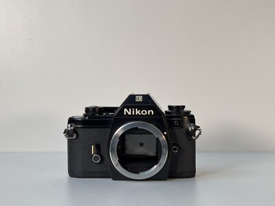Nikon EM 35mm SLR Film Camera, W/ 1 Roll Of Film, Shutter Fires - Sold ...