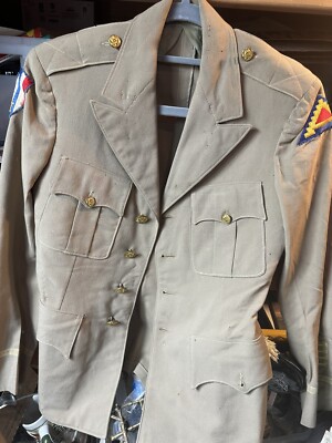 Vintage/undated US Army jacket with buttons and patches. Has some ...