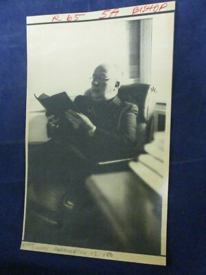 1983 Bishop Timothy J. Harrington reads bible in office Vintage Wire ...