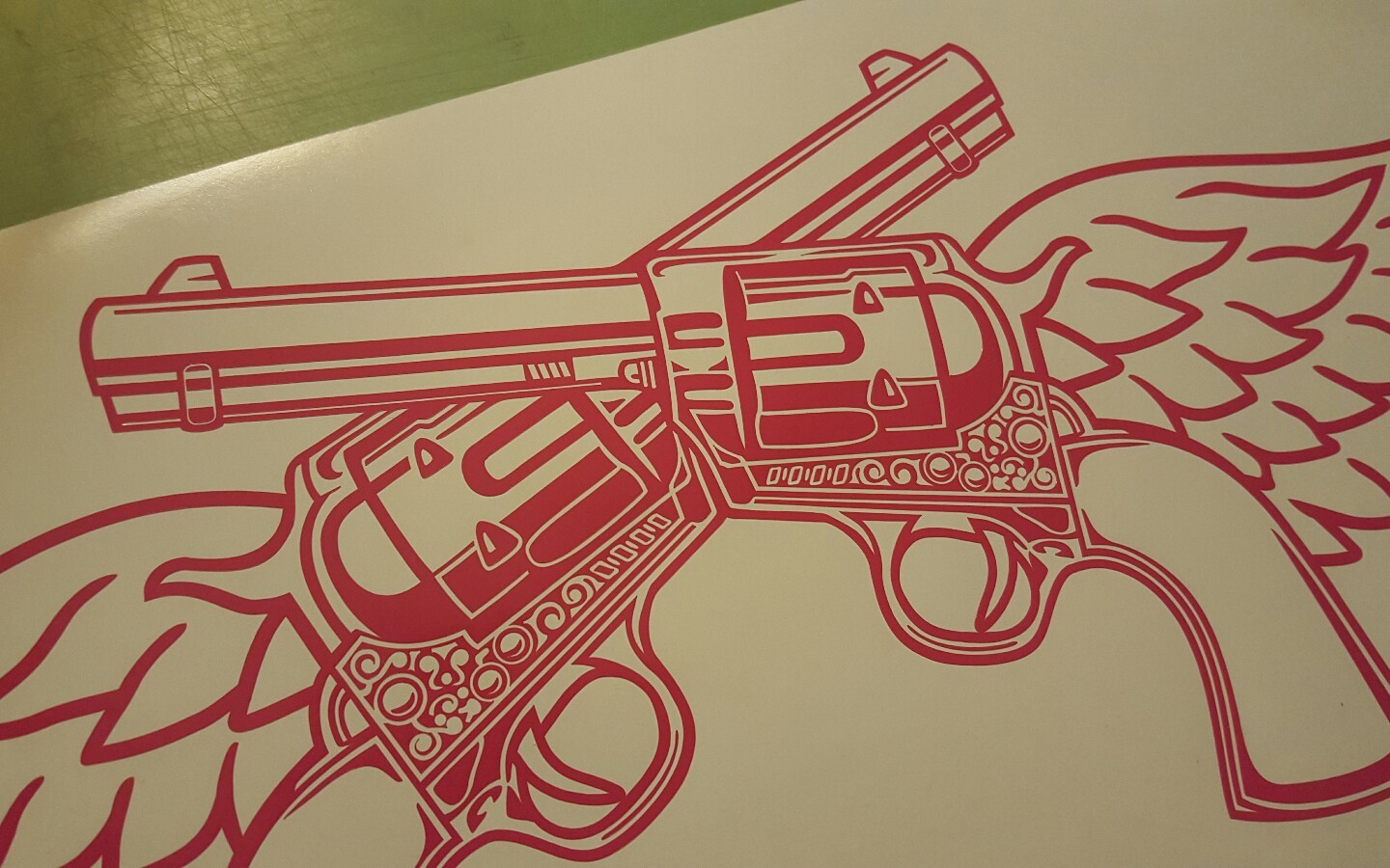 Crossed Pistols With Wings