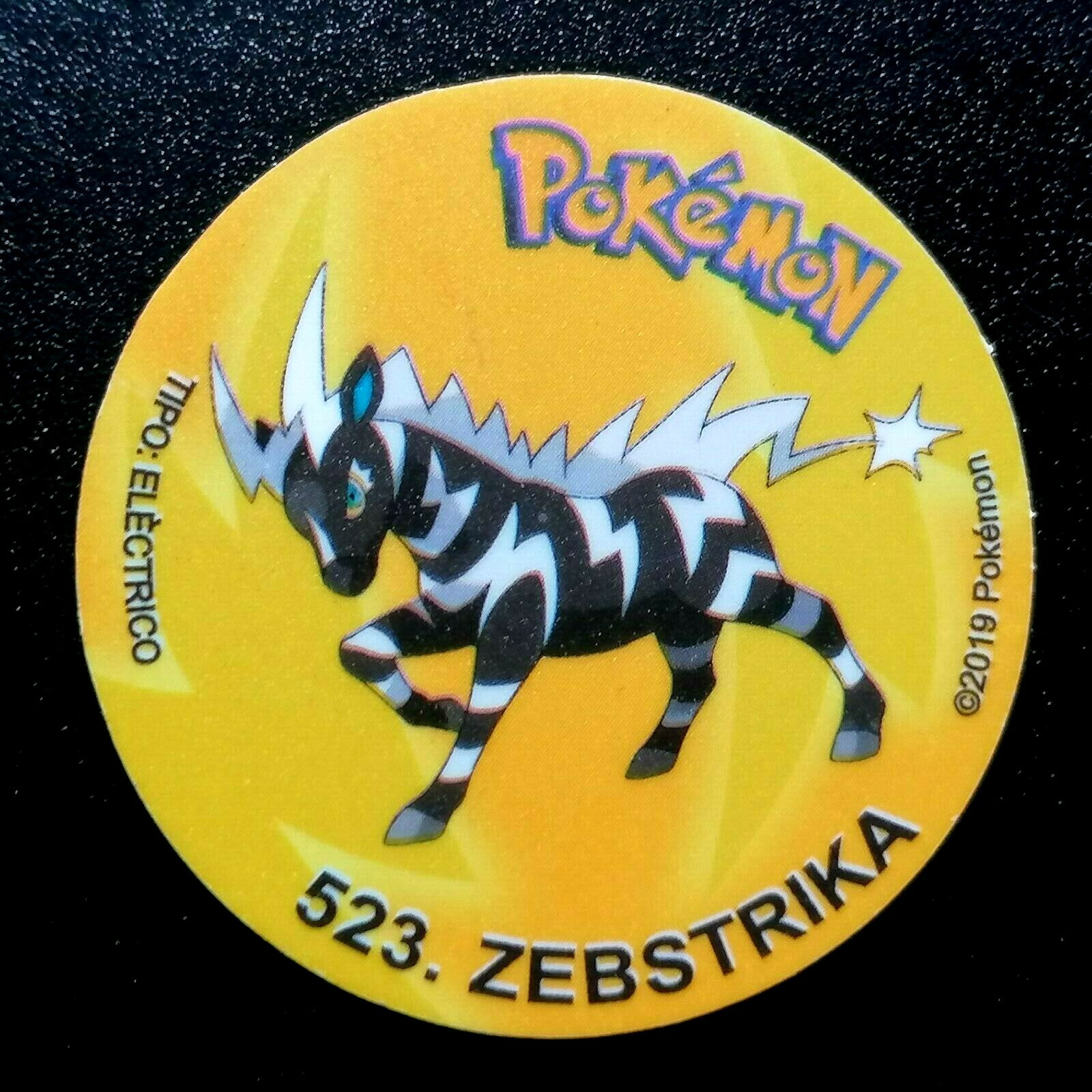 TAZO POKEMON DKV #523 ZEBSTRIKA 2019 Unova PERU South America Pogs Taps ...