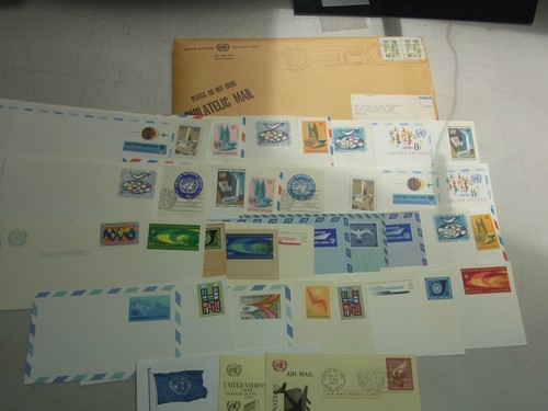 1975 UNITED NATIONS MAILER PACKET OF 37 NEW ENVELOPES & POSTCARDS SOME ...