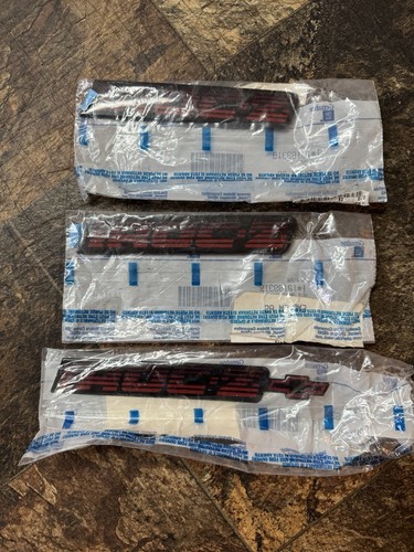 NOS GM 85-90 IROC Camaro Red Rear Bumper Side Skirt Gfx Emblem Set | eBay