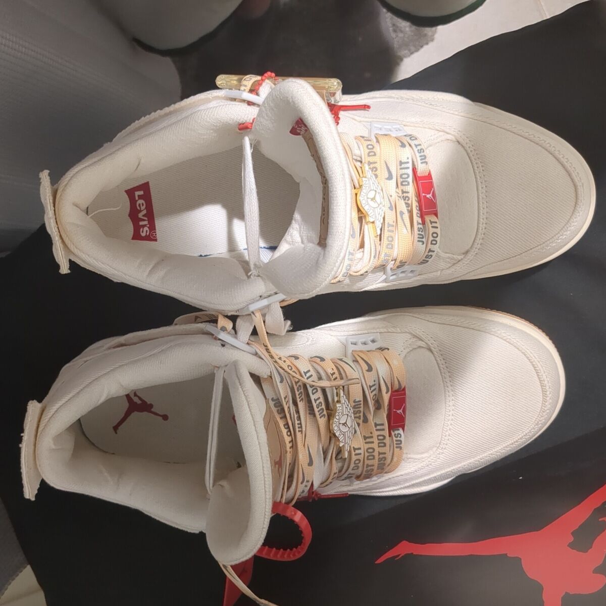 Size 10 - Levi's x Air Jordan 4 Retro White Denim Size 10 - Levi's x Air Jordan 4 Retro White Denim