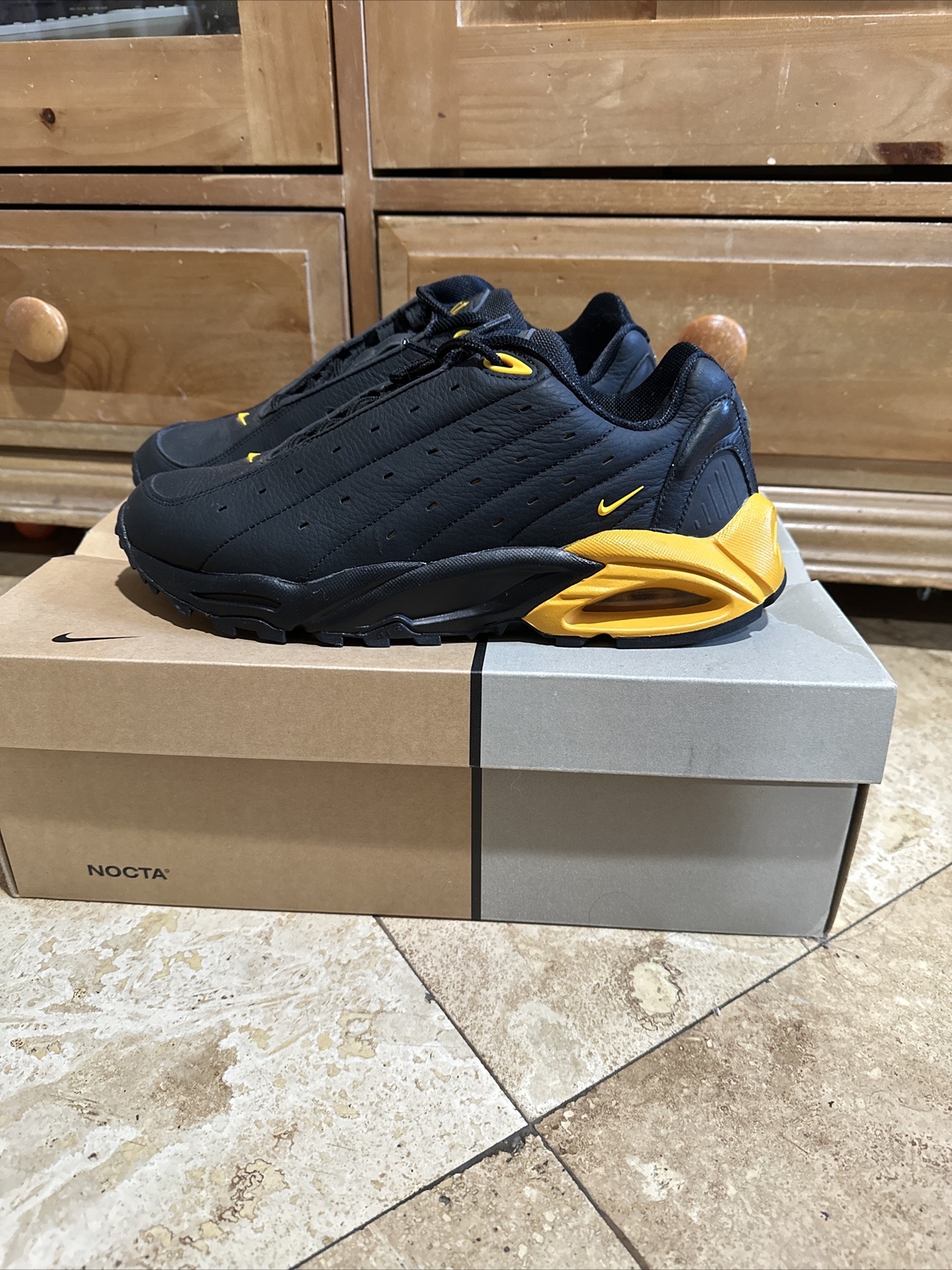 Nocta x Nike Hot Step Air Terra Black University Gold… - Gem