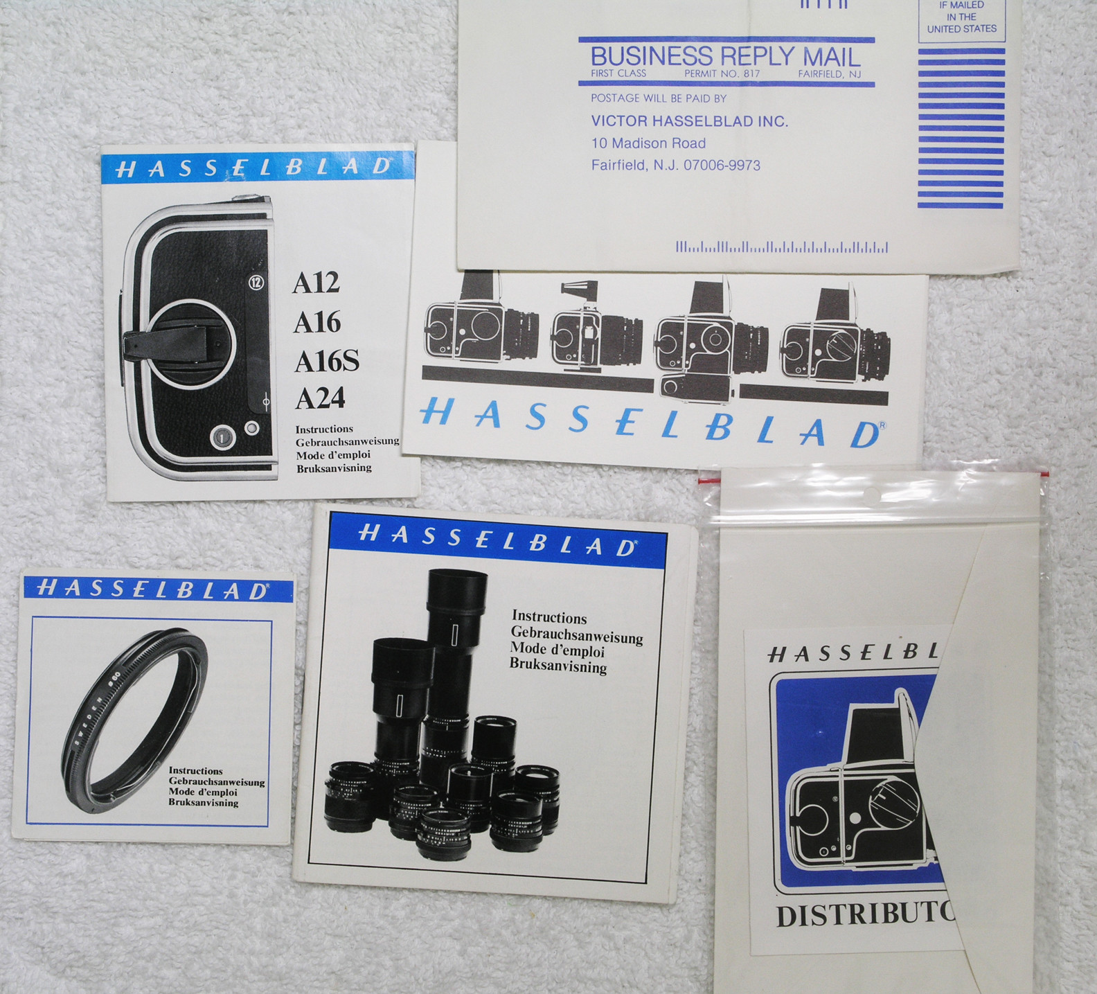 Hasselblad back, lenses, and lens mounting rings and registration cards ...