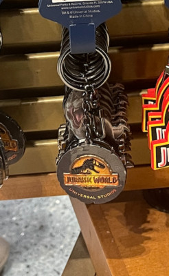 Universal Studios Jurassic World Outlined T-Rex Amber Logo Enamel ...