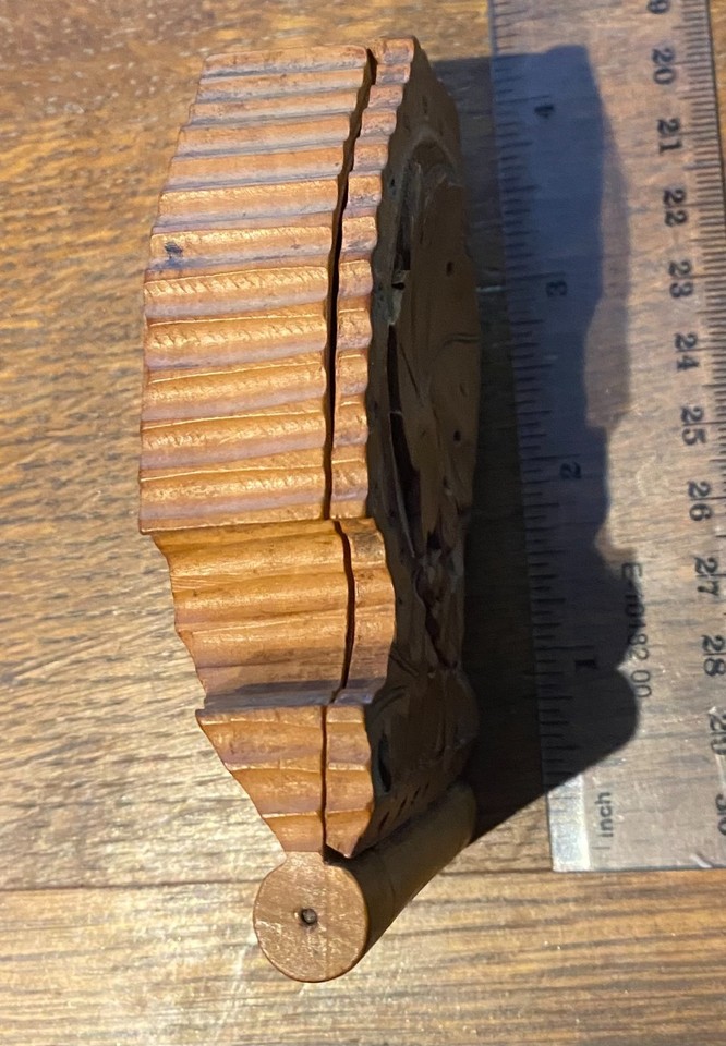 Silver pocket watch in a carved traveling stand Possibly Black Forest ...