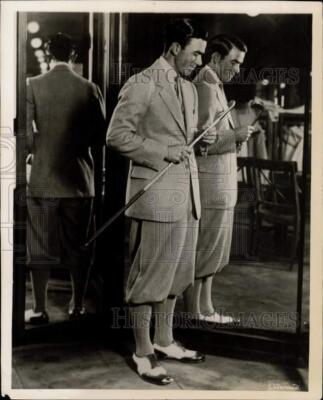 Press Photo Golfer Johnny Farrell models fashionable outfit with cane ...