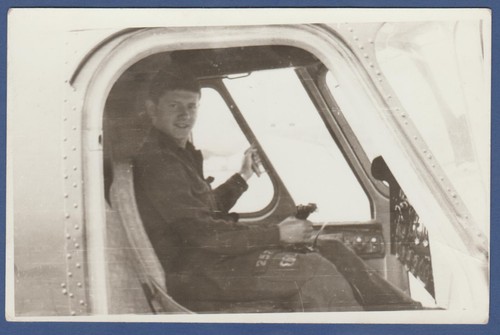 Beautiful Soviet guy soldier in the cockpit of a helicopter or airplane ...