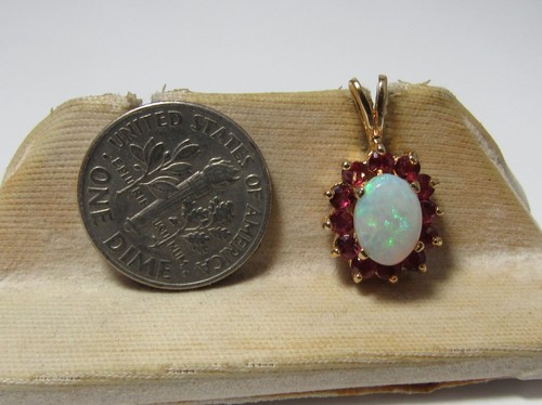 QUALITY 14K GOLD PENDANT W / OVAL NATURAL OPAL SURROUNDED BY RED ROUND ...