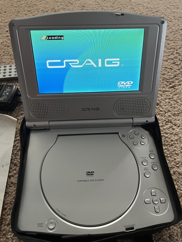 CRAIG 7” TFT PORTABLE DVD PLAYER MODEL CTFT701 RECHARGEABLE BATTERY ...