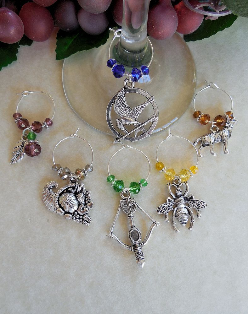 6 Wine Glass Charms Inspired by Hunger Games, Catching Fire, Mockingjay ...
