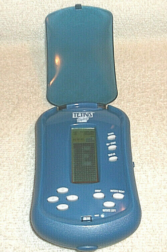 RADICA LIGHTED FLIP TOP TETRIS BLUE HANDHELD ELECTRONIC GAME 2006 ...