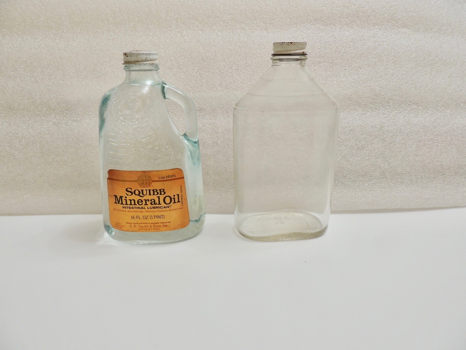 lot of 2 - vintage clear glass Squibb bottle, clear glass mineral oil ...