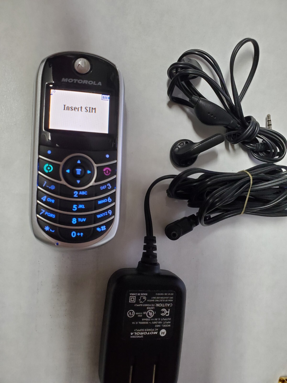 Motorola Tracfone C139 works, w/charger & earpiece needs, SIM card for ...