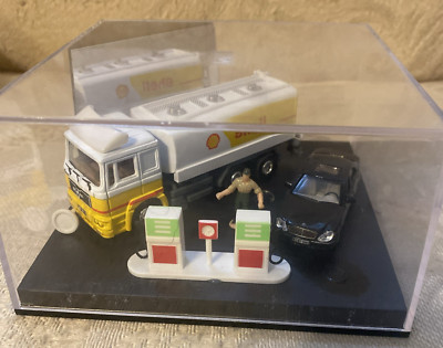 Encased Shell Fuel Tanker Truck with Car Driver and Fuel Pumps Model ...