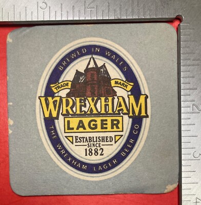 WREXHAM LAGER."ESTABLISHED SINCE 1882". 3.5 INCH SQUARE BEER COASTER ...