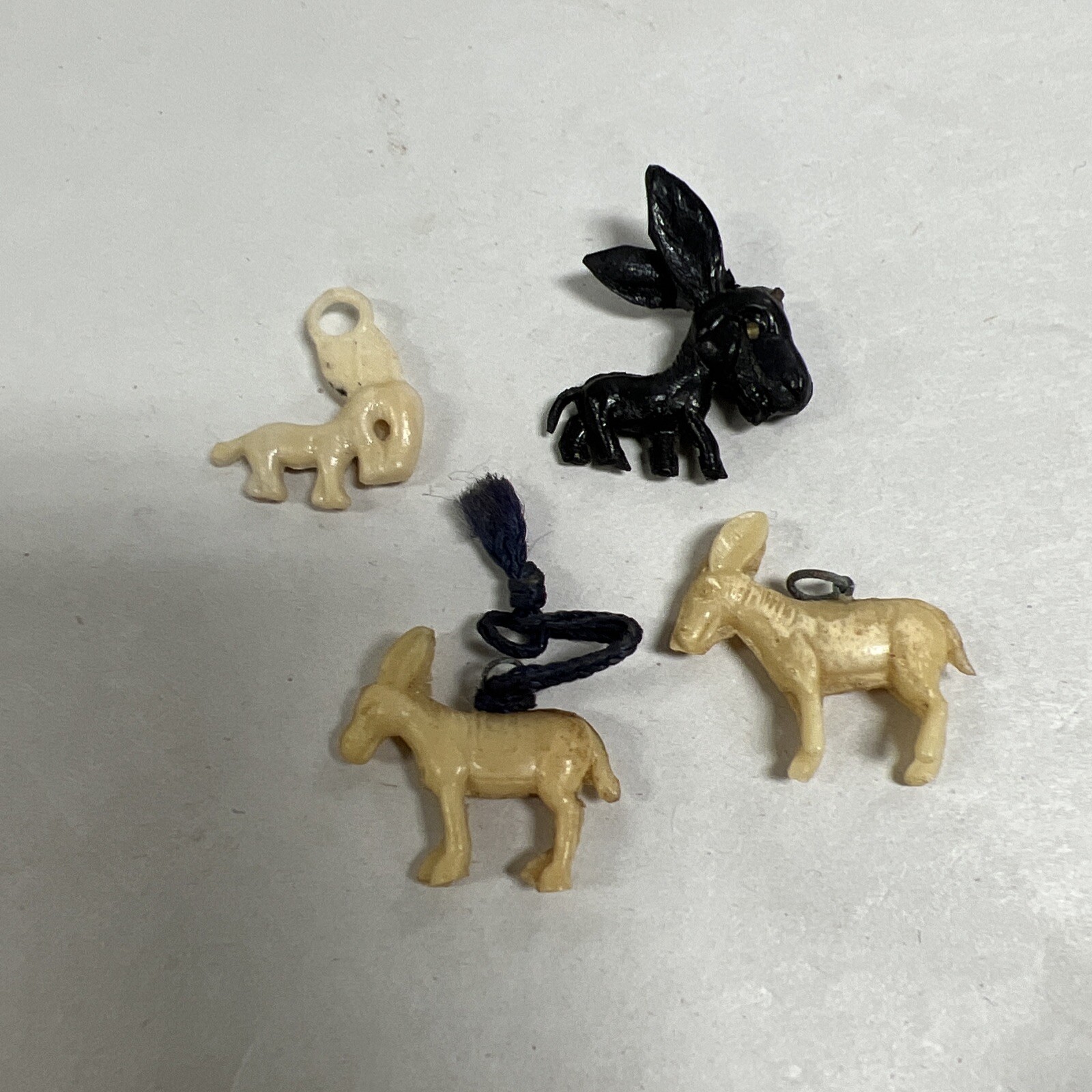 LOT OF 4 VINTAGE CELLULOID VARIOUS DONKEY MULE CHARMS CRACKER JACK TOY ...