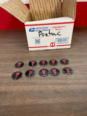 LOT OF 10 NOS VINTAGE PONTIAC SYMBOL EMBLEMS LOGOS ORNAMENTS BADGES ...
