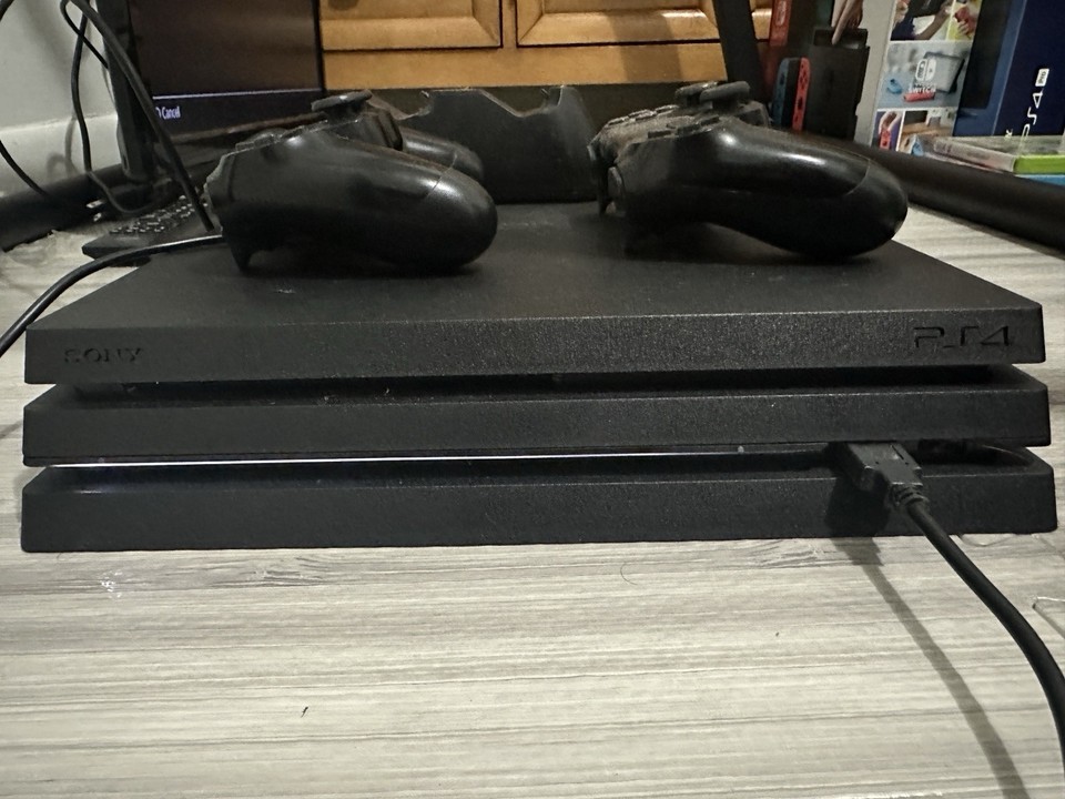 Sony PlayStation 4 Pro 1TB Game Console - Jet Black With 2 Controllers ...