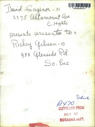 1957 Press Photo David Saginor Presents Present to Rickey Gibson ...