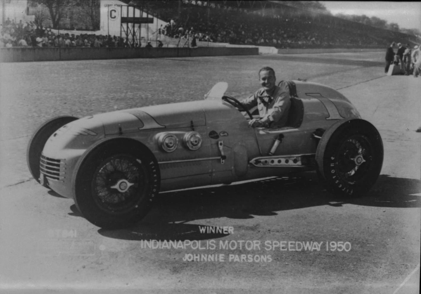 Johnnie Parsons, winner of the 1950 Indianapolis 500, sits behi 1950 ...