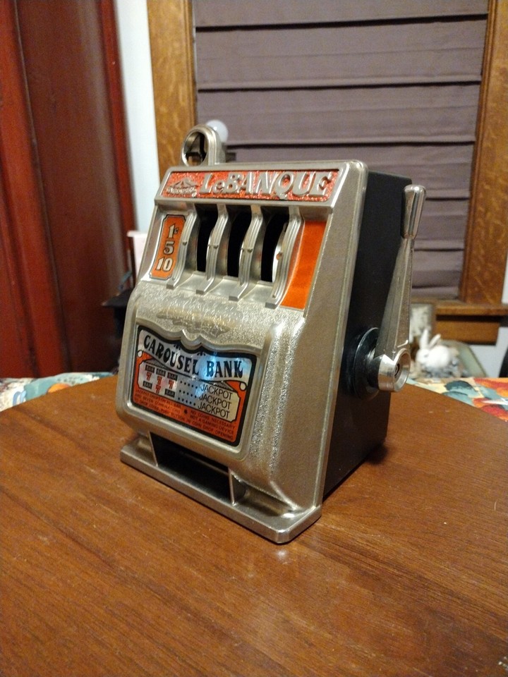 Vintage LeBanque One Arm Banker Toy Slot Machine Coin Carousel Bank | eBay