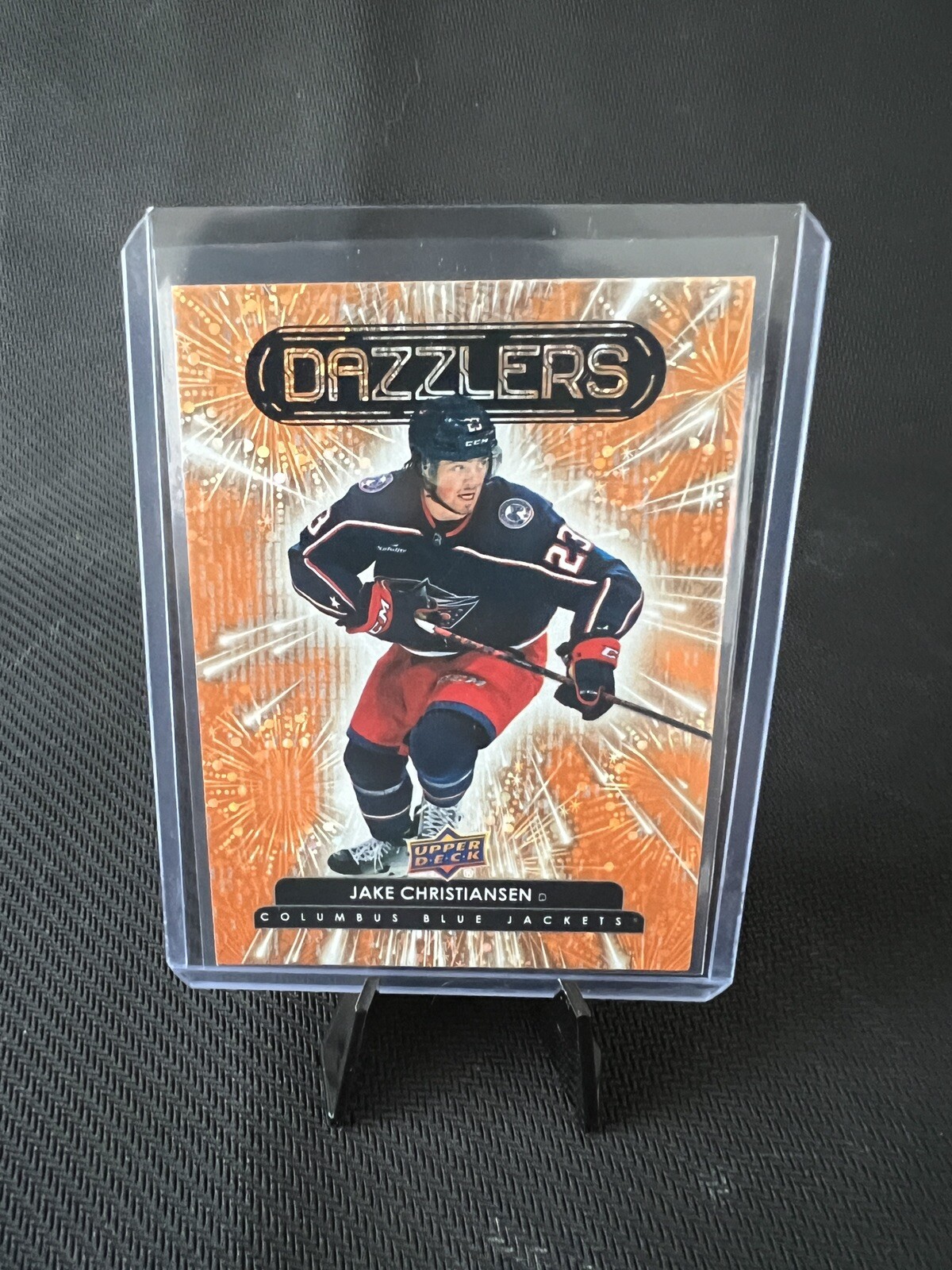 2022-23 Upper Deck Series 2 - Dazzlers Orange #DZ-98 Jake Christiansen ...