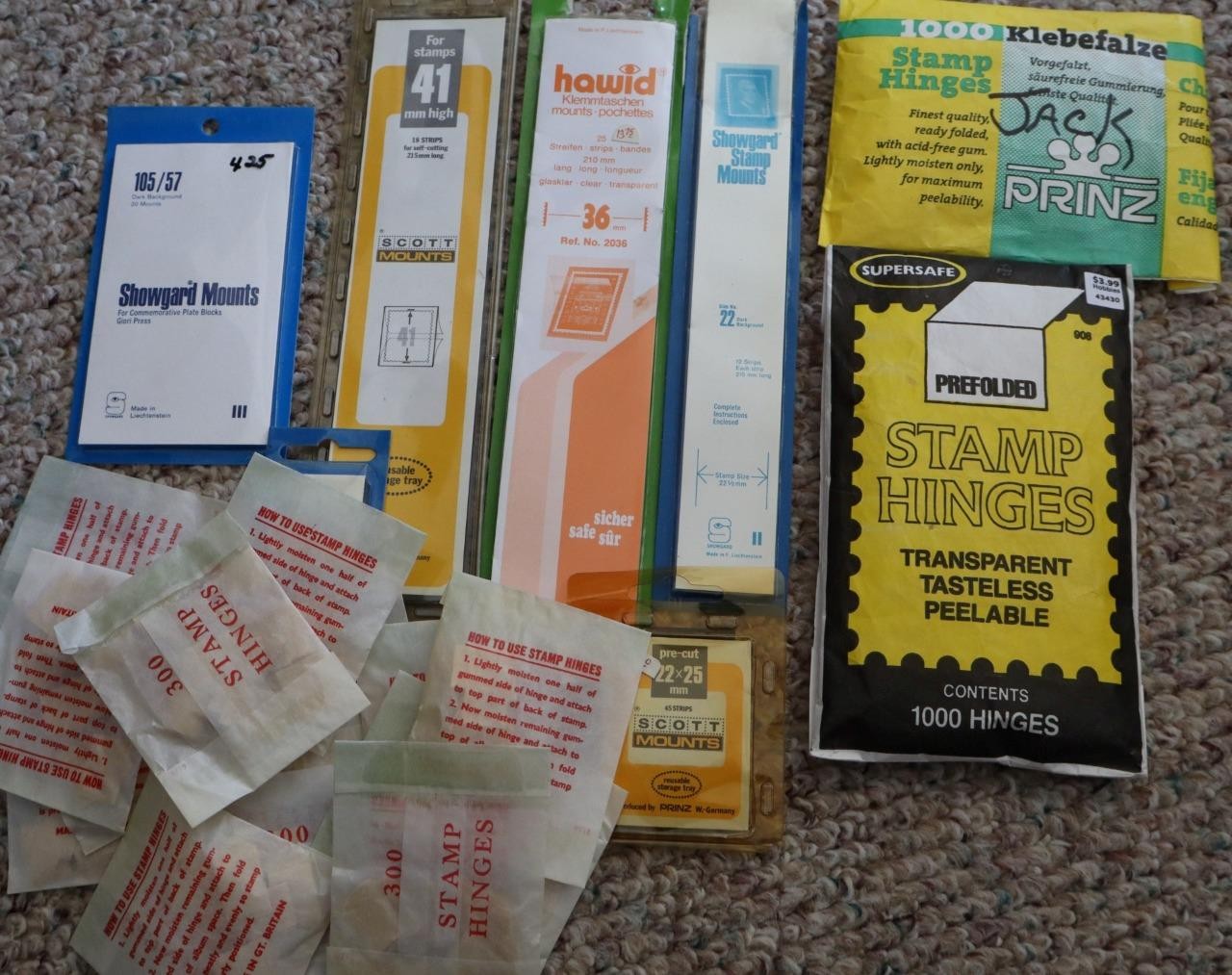 STAMP HINGES, 12 PACKS OF 300, MADE IN G. B. + HINGES & MOUNTS SOME ...