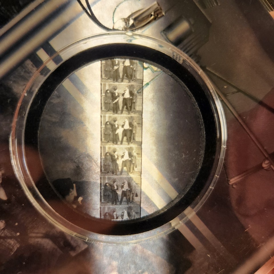 charlie chaplin vintage film cells. strip inside round case, photo ...