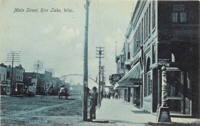 c1907 Postcard Rice Lake WI Main Street at Eau Claire St Business Signs ...