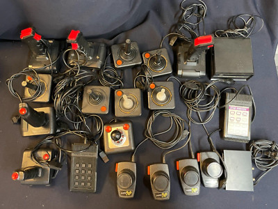 Atari lot of 19 controllers and RF Modulator; joysticks, touch pad ...